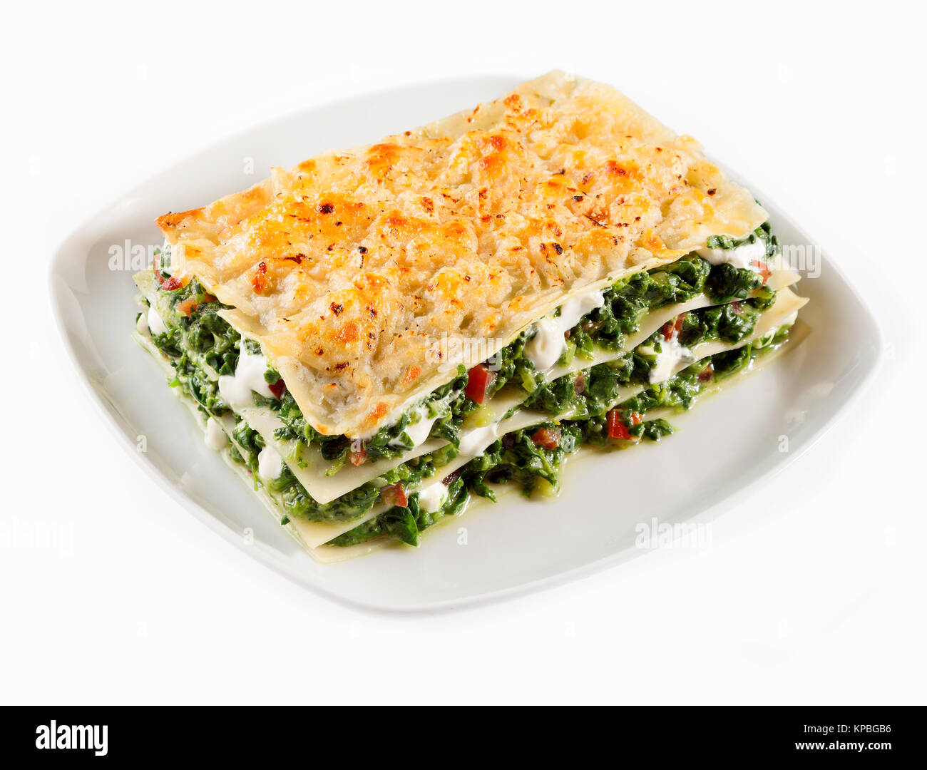 Portion of traditional Italian lasagne with spinach and mozzarella ...