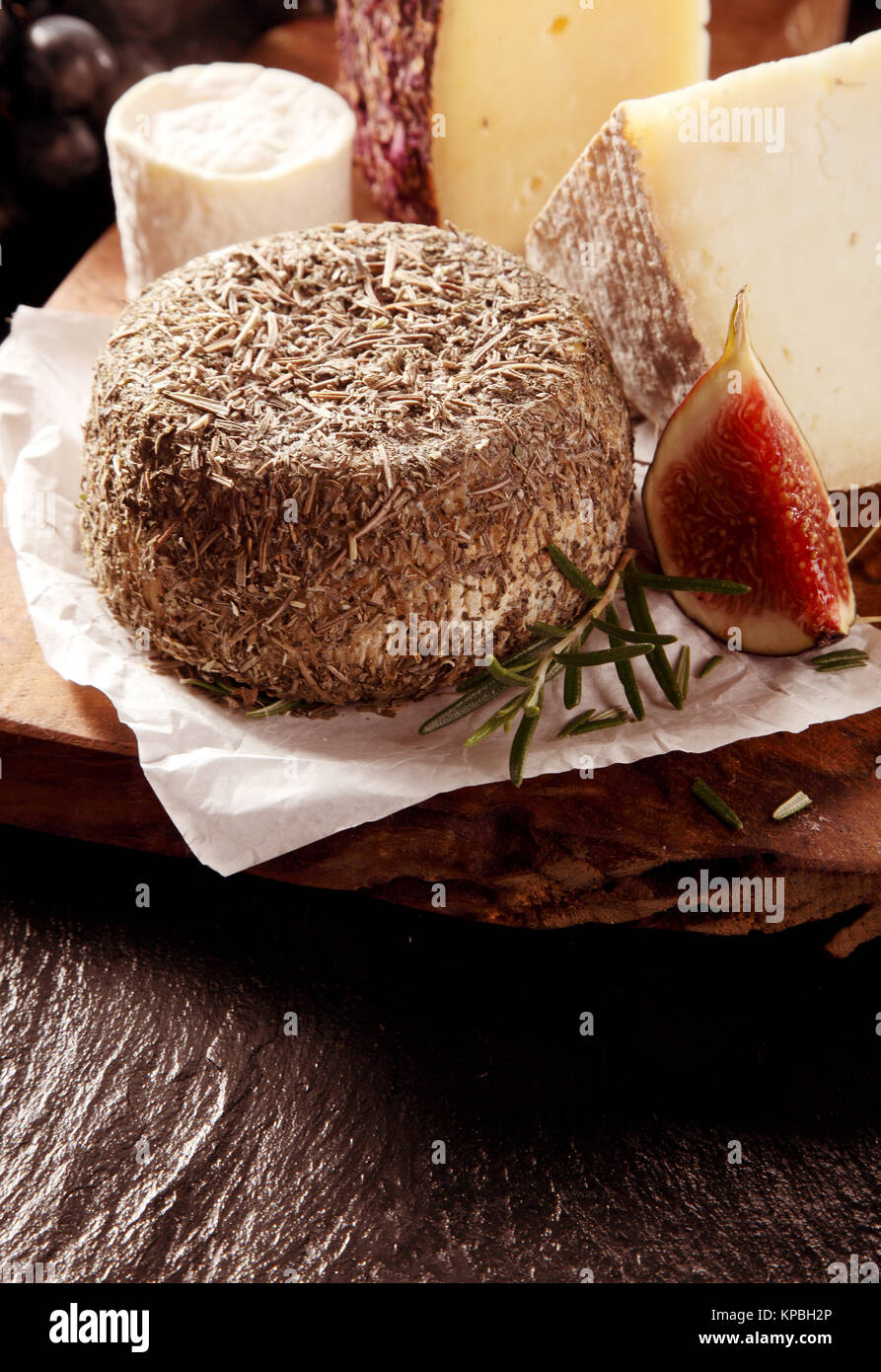 Close Up of Round Wheel of Soft Cheese Coated in Savory Dried Herbs and ...
