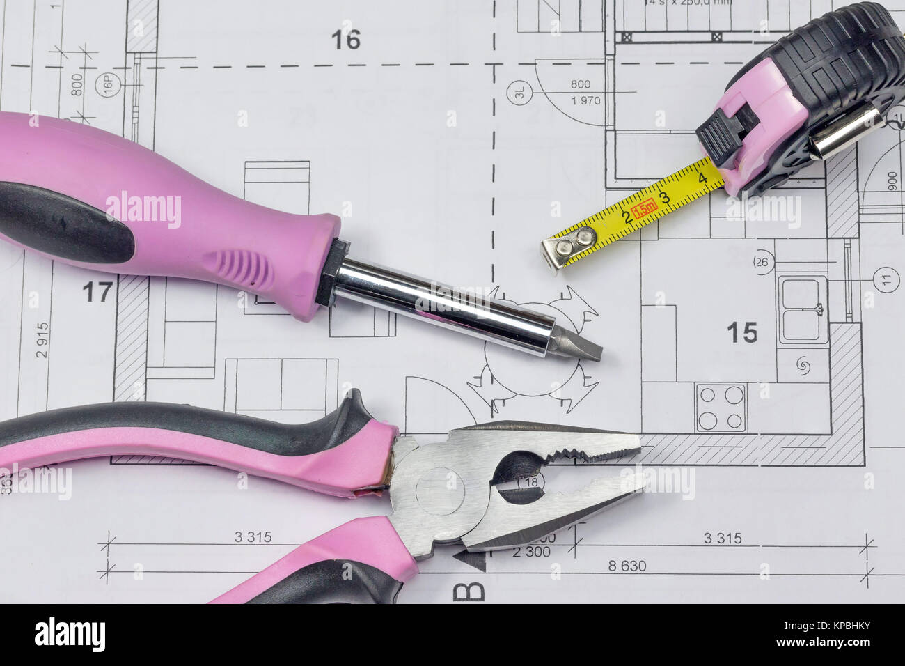 Tools for housework lying on the blueprint Stock Photo - Alamy