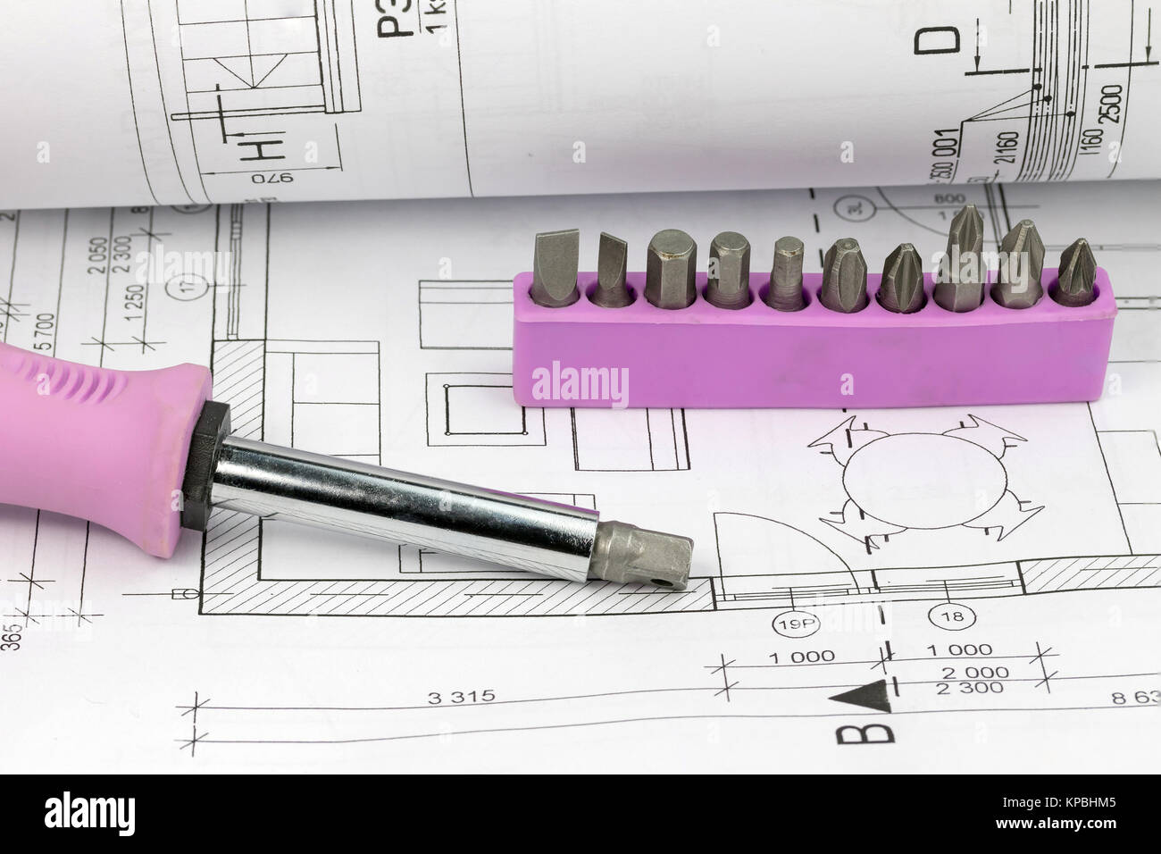 Screwdriver and set of bits on the blueprint Stock Photo - Alamy