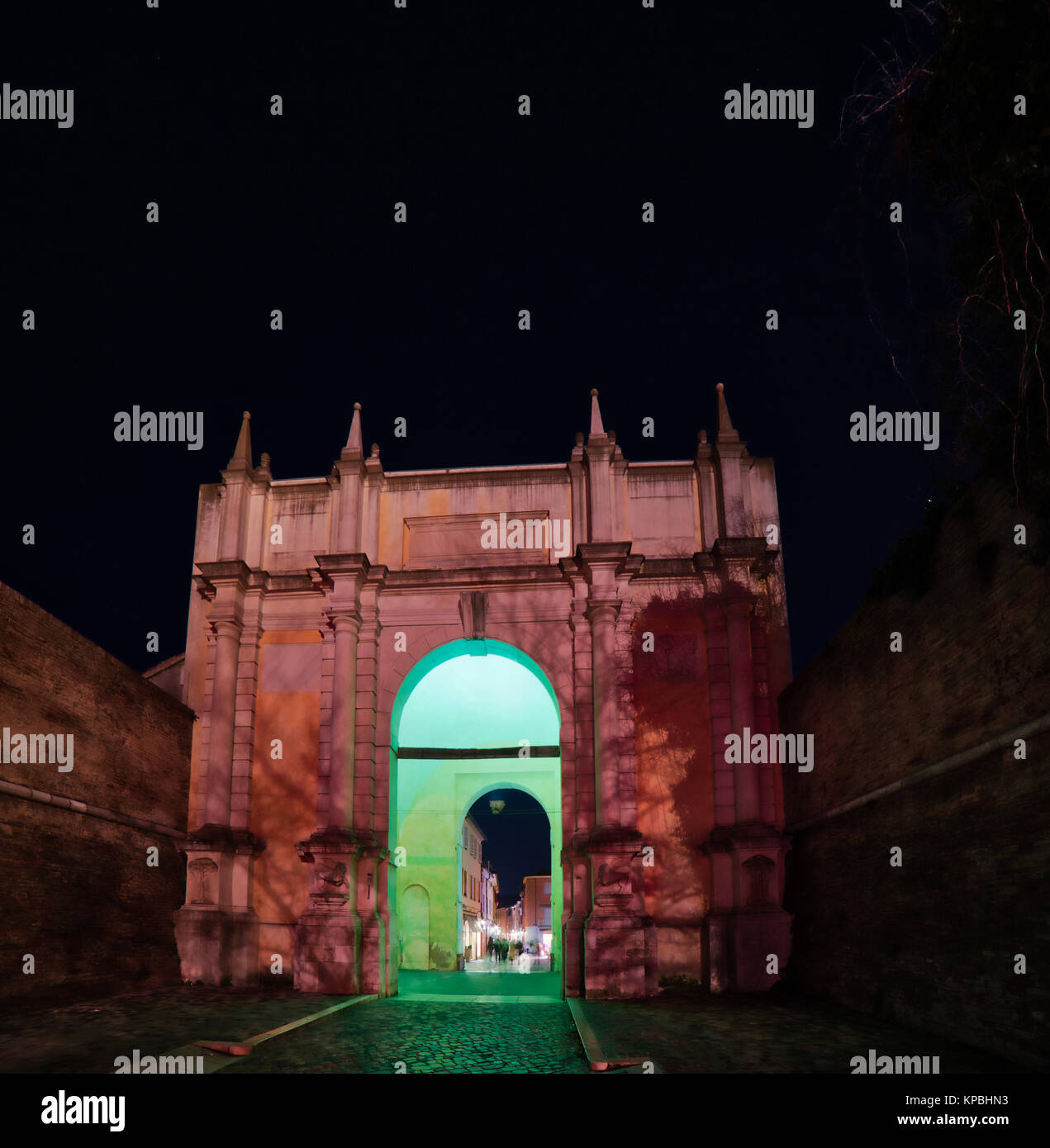 night view of monumental medieval entry to shopping area of the ...