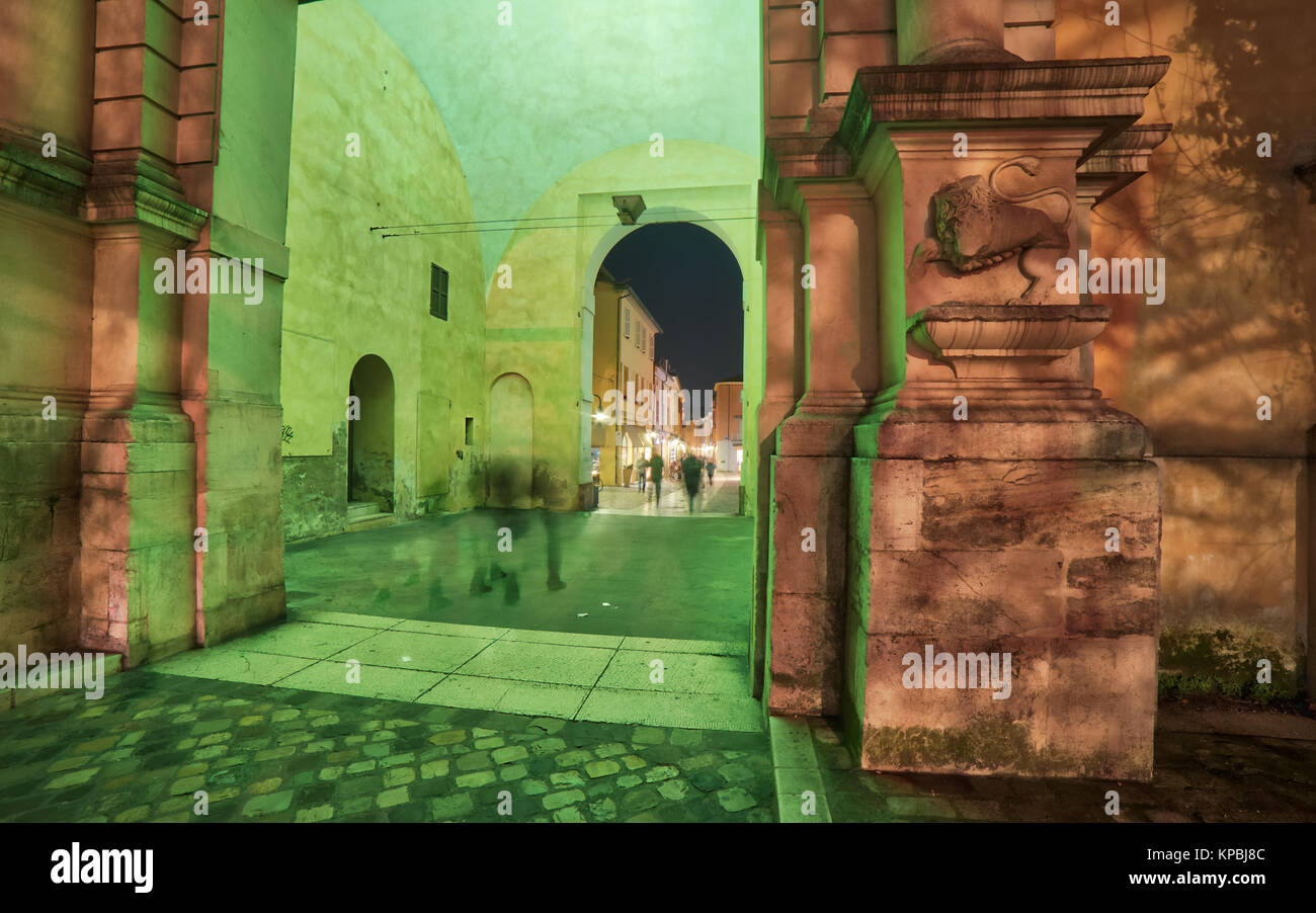 night view of monumental medieval entry to shopping area of the ...