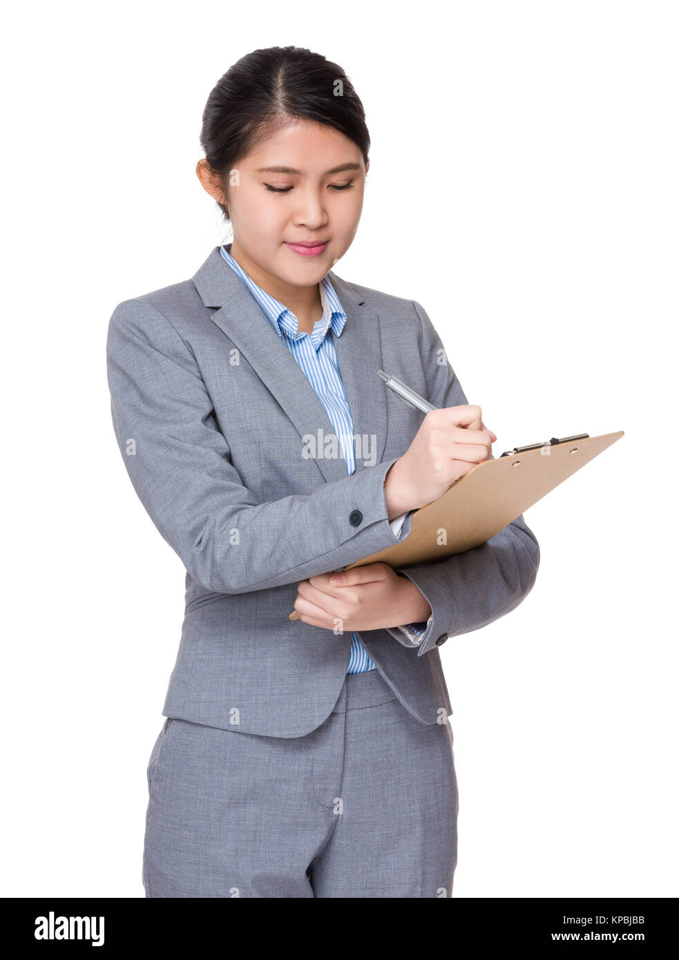 Asian businesswoman take note on clipboard Stock Photo - Alamy