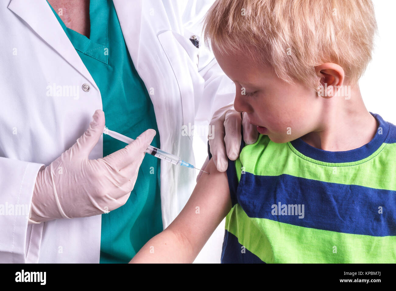 little boy is given an injection by the family doctor Stock Photo - Alamy