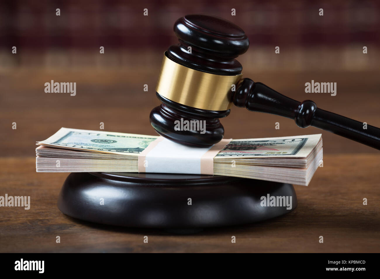 Mallet Being Hit On Dollar Bundle In Courtroom Stock Photo - Alamy