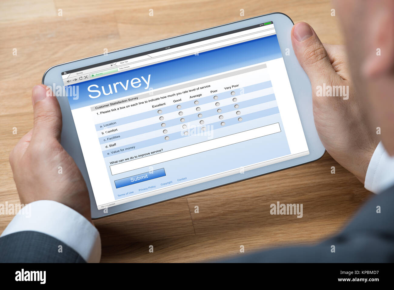 Businessman Giving Online Survey On Digital Tablet Stock Photo - Alamy