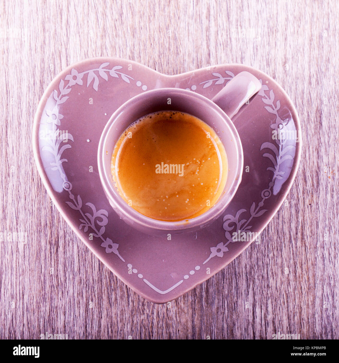 Coffee cup over table Stock Photo - Alamy