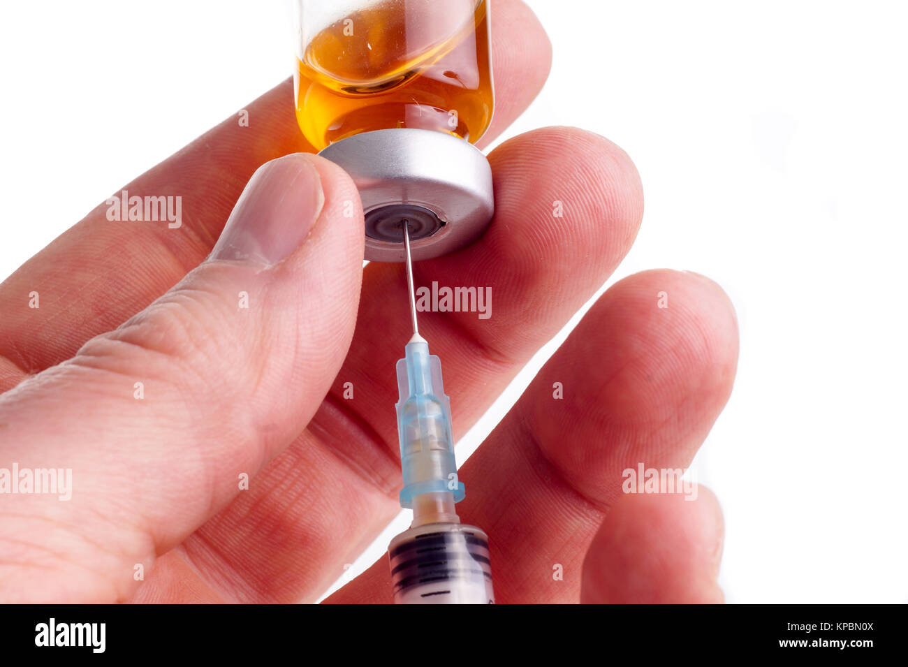 Hand holding syringe and medicine vial Stock Photo - Alamy