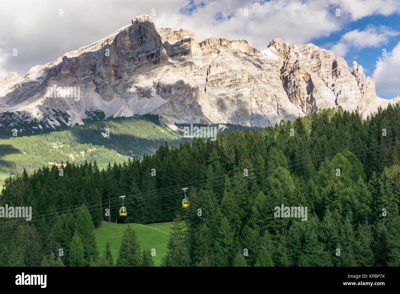 yellow cable car cabins transporting tourists in the South Tyrol in the ...
