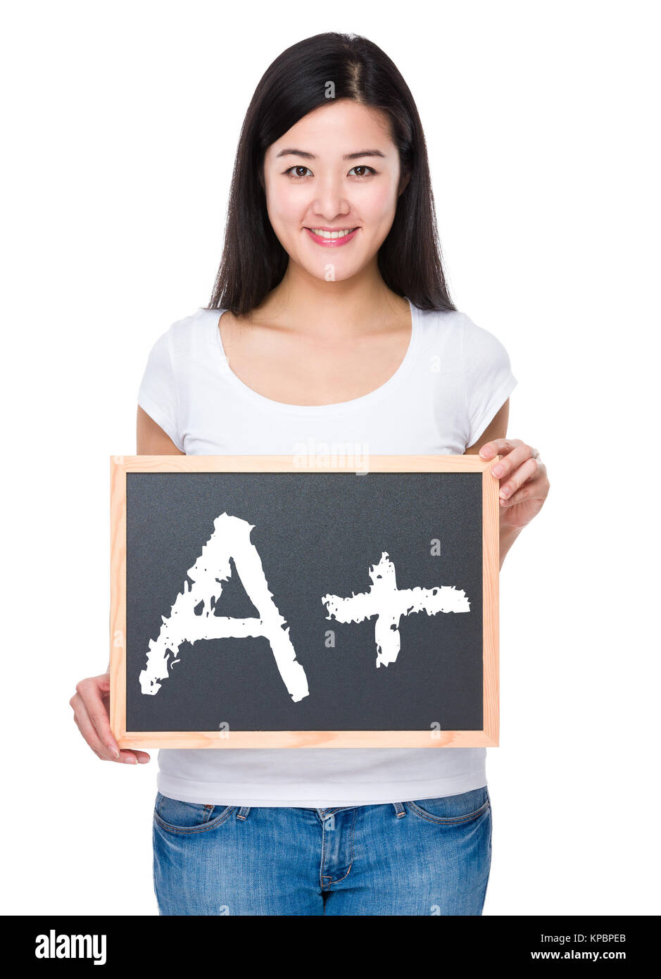 Student with chalkboard showing A plus mark Stock Photo - Alamy
