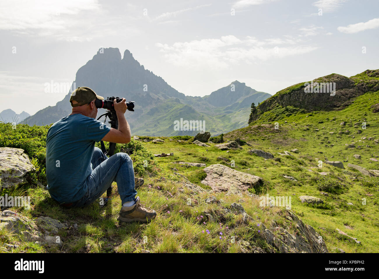 man hiker with camera and taking picture of beautiful mountain Stock ...