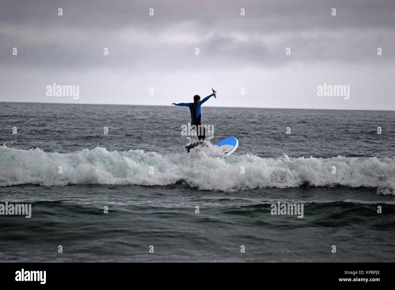 Stand up paddleboarder jumping off board as wave hits in Dingle ...