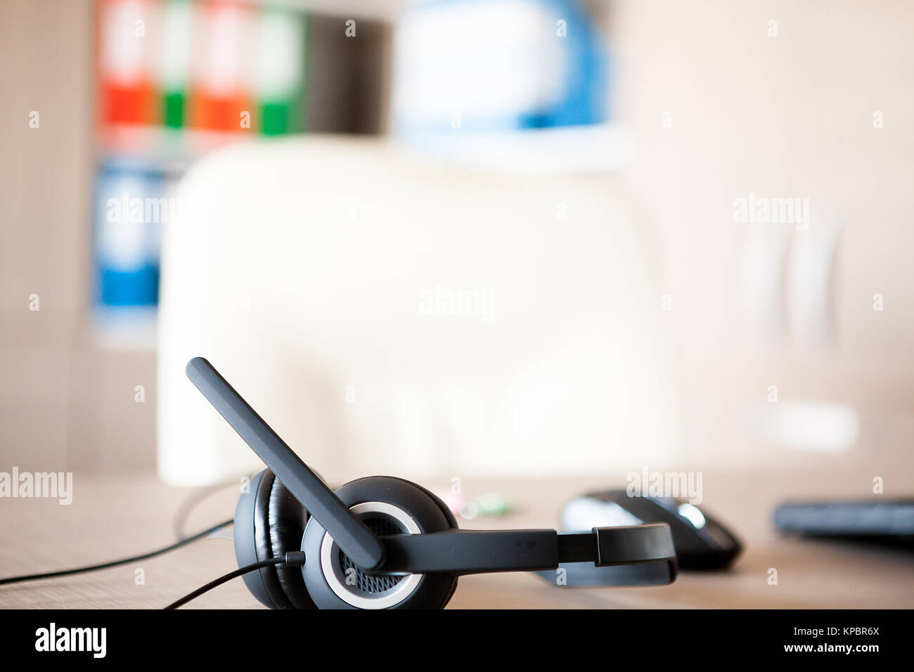 Close up image of a headset lying on a table Stock Photo - Alamy