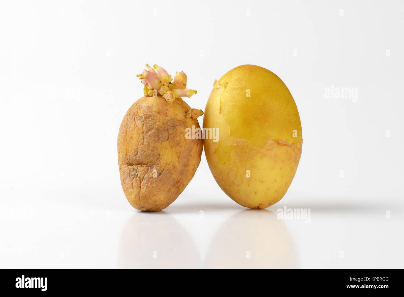 young and old potatoes Stock Photo - Alamy
