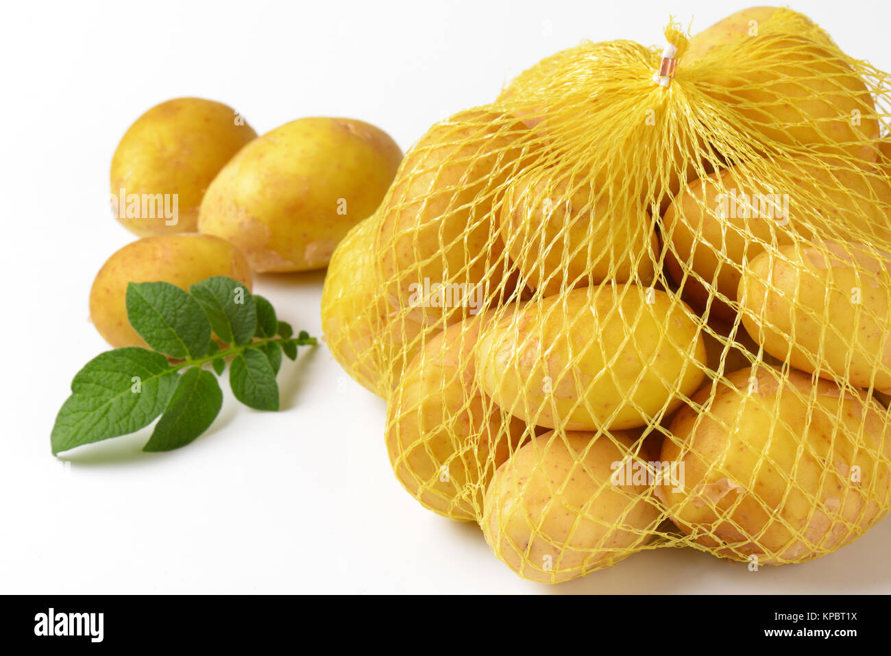 potatoes in net bag Stock Photo - Alamy