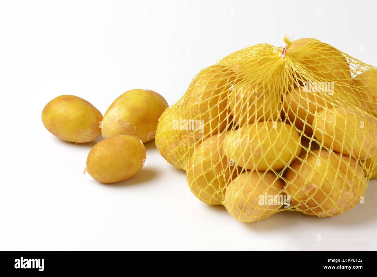 potatoes in net bag Stock Photo - Alamy