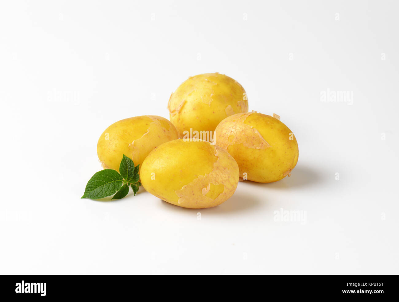 four new potatoes Stock Photo - Alamy