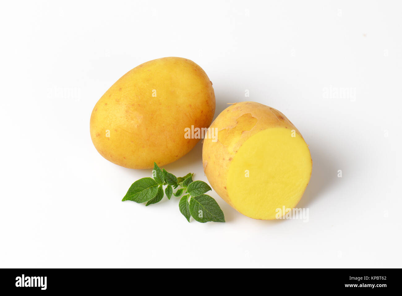 whole potato and half Stock Photo - Alamy