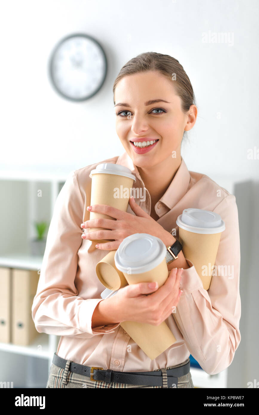 smiling woman with coffee cups Stock Photo - Alamy