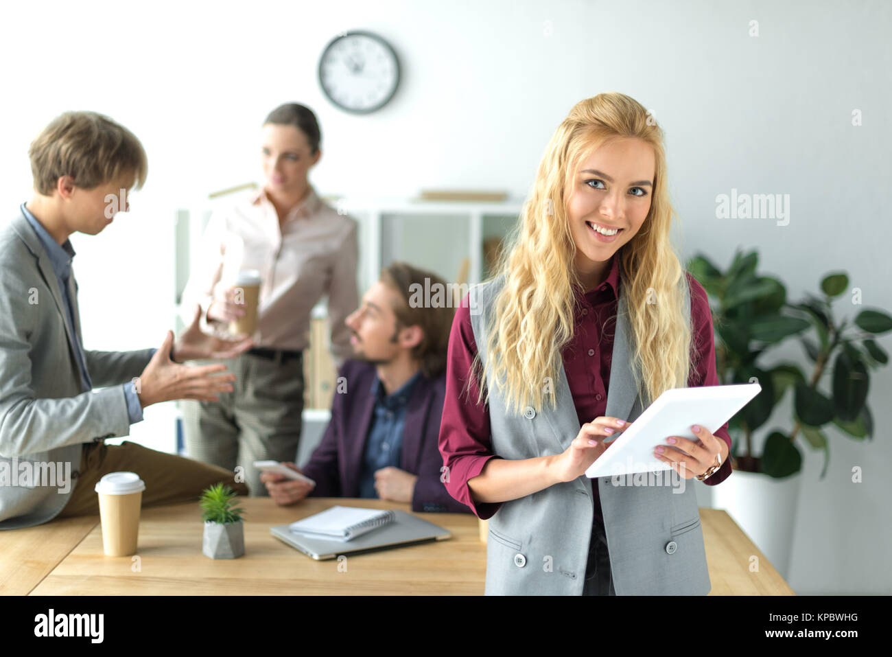 Team leader holding tablet Stock Photo - Alamy