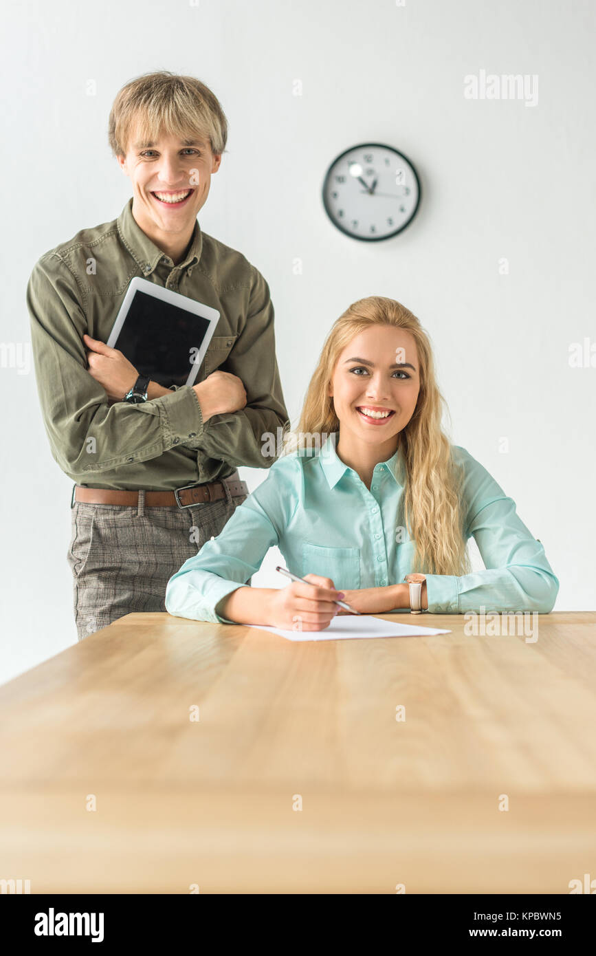 Smiling colleagues in the office Stock Photo - Alamy
