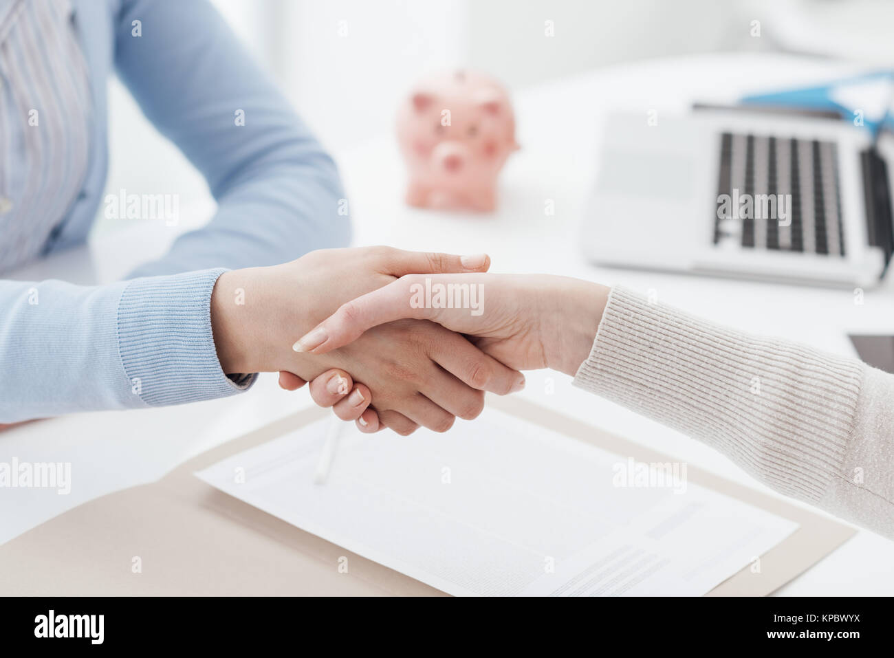 Financial advisor and customer meeting in the office and shaking hands ...