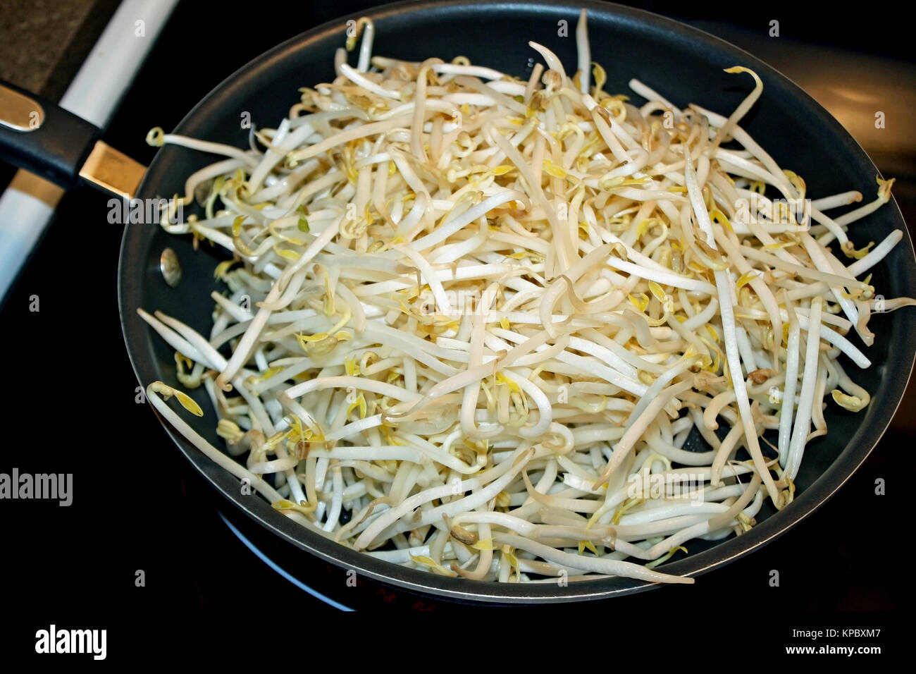 Fresh organic bean sprouts in frying pan ready for cooking Stock Photo ...