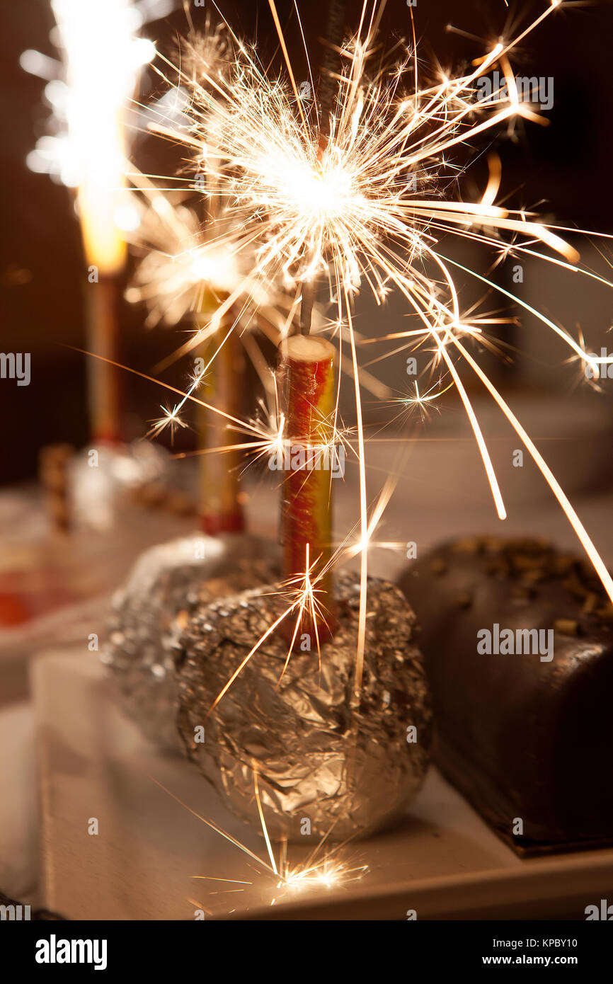 Sparkler on ice cream Stock Photo - Alamy