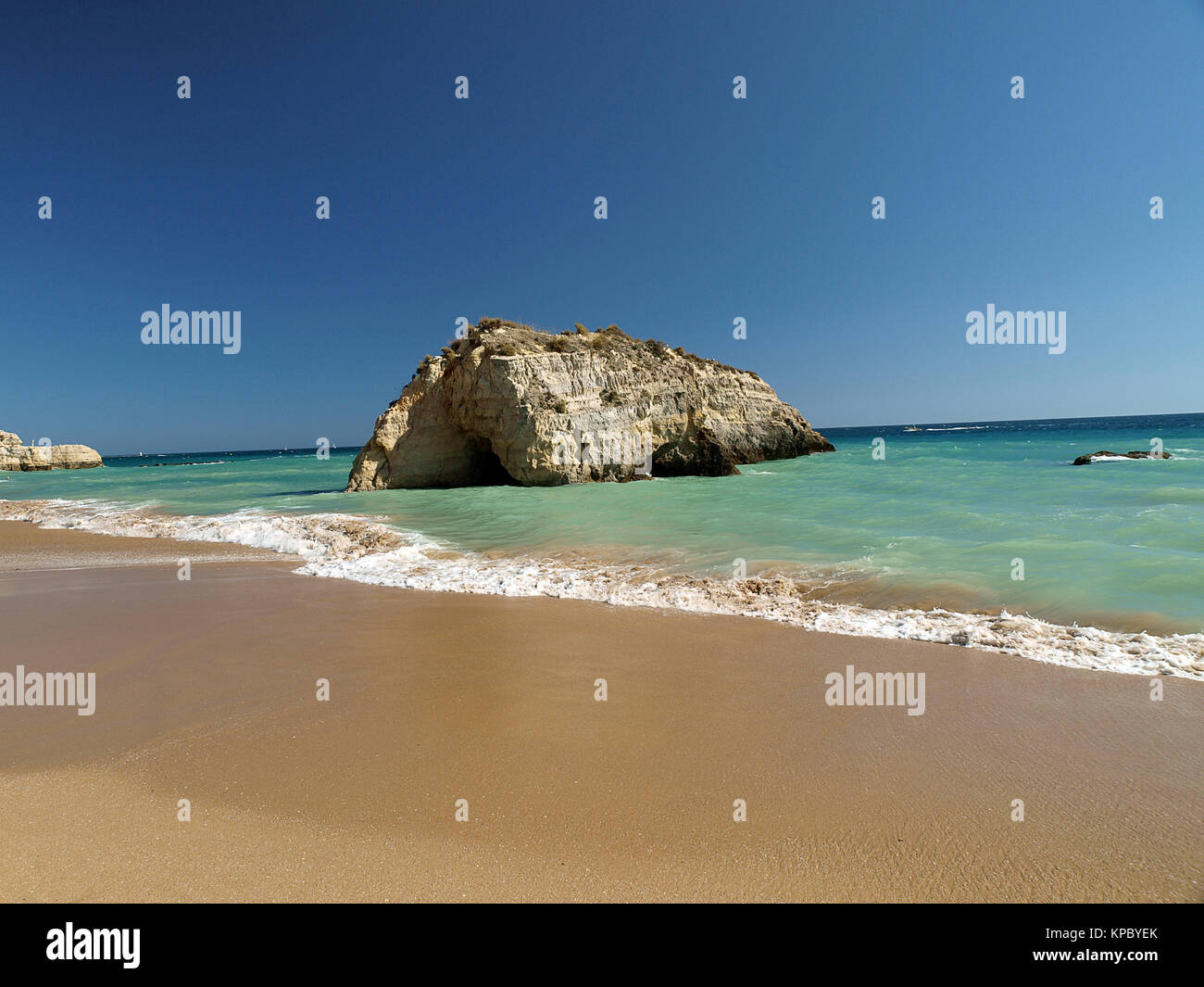 A section of the idyllic Praia de Rocha beach on the southern coast of ...
