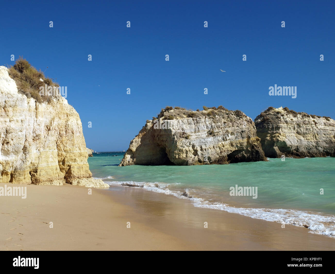 A section of the idyllic Praia de Rocha beach on the southern coast of ...