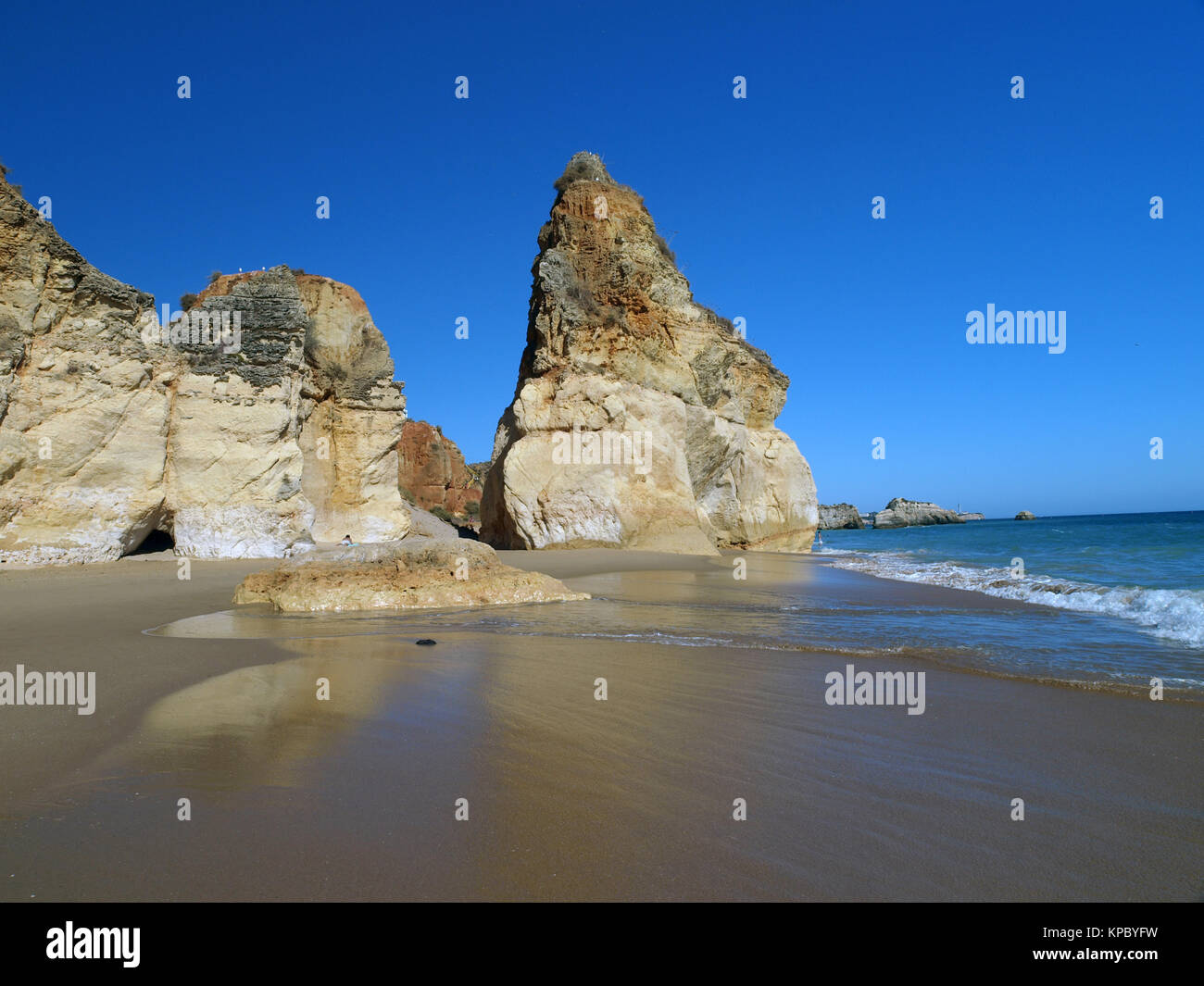 A section of the idyllic Praia de Rocha beach on the southern coast of ...