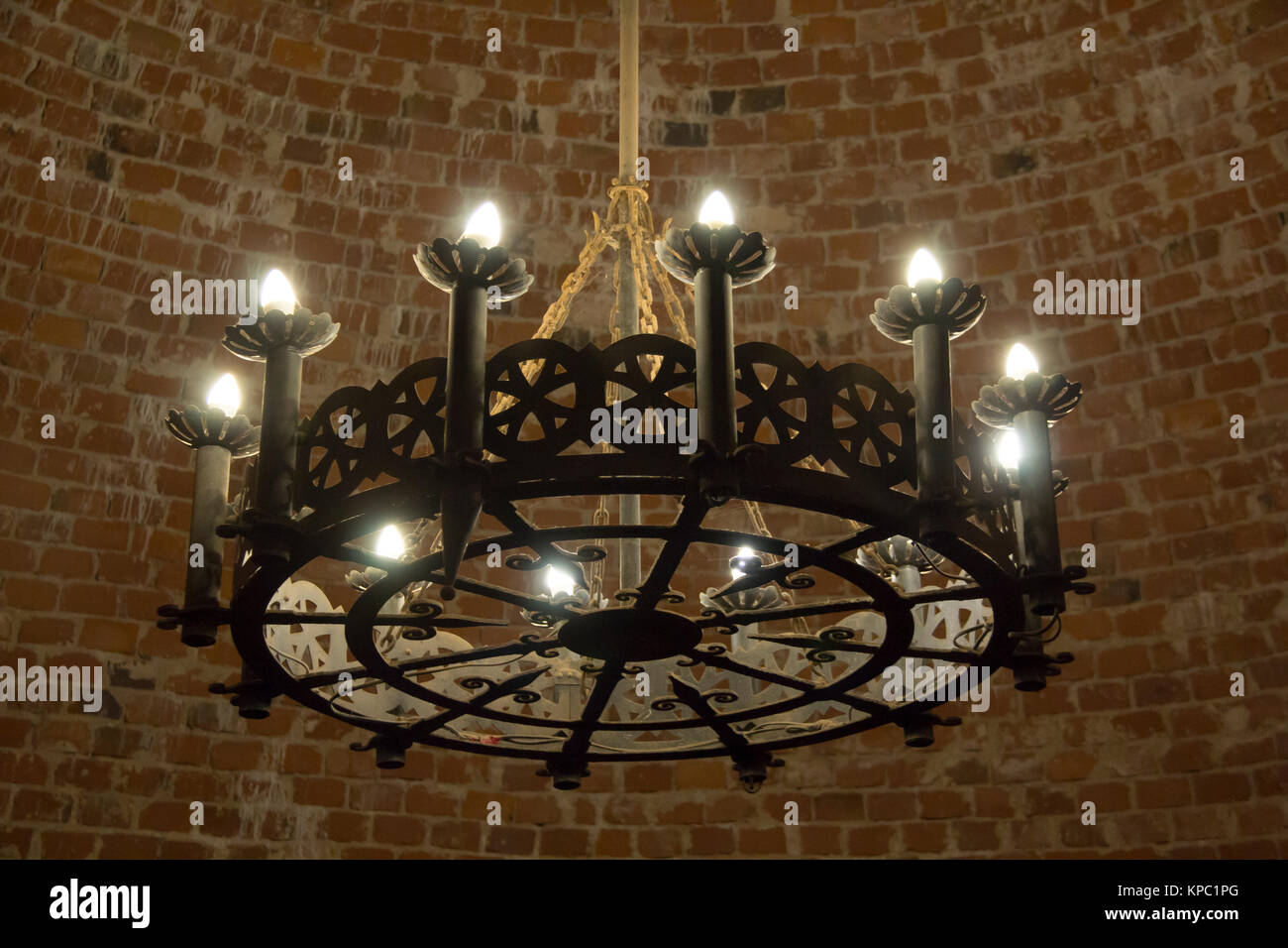 An ancient Middle Ages chandelier on a brick castle ceiling Stock Photo ...