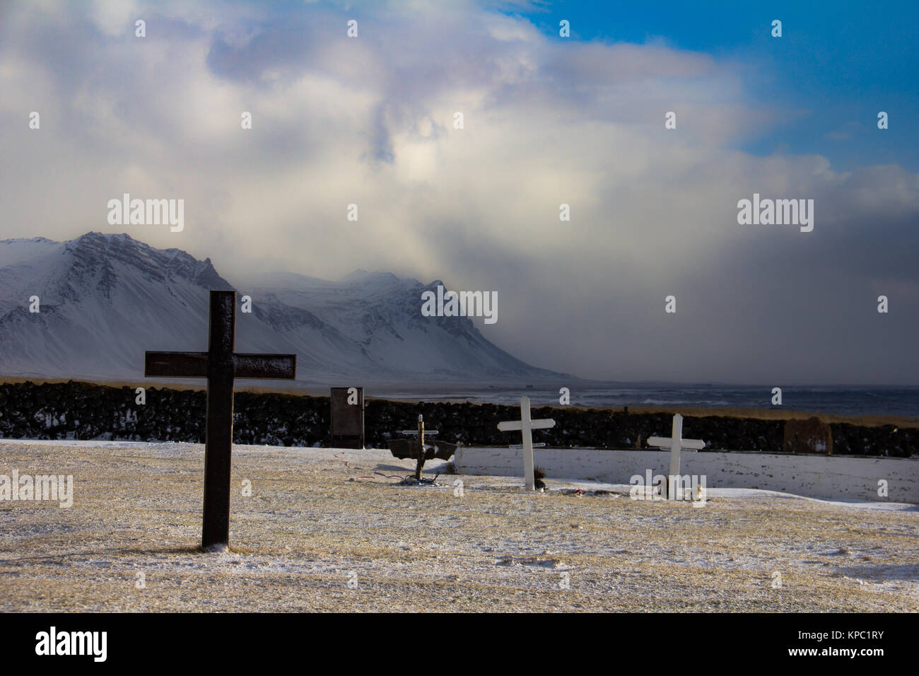 Cemetery in Iceland with several cross grave markers and dramatic ...
