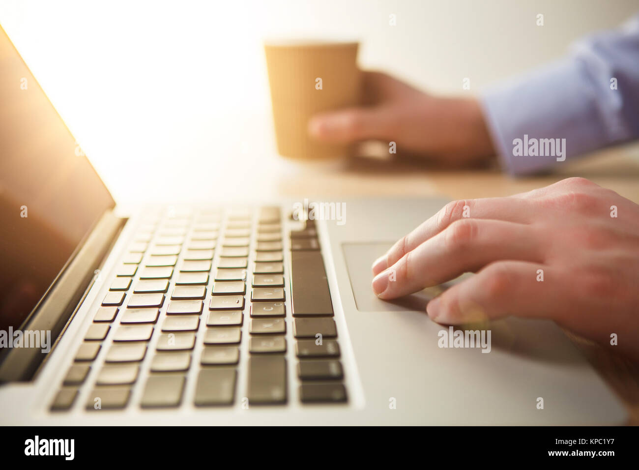 The hand on the keyboard and coffee Stock Photo - Alamy