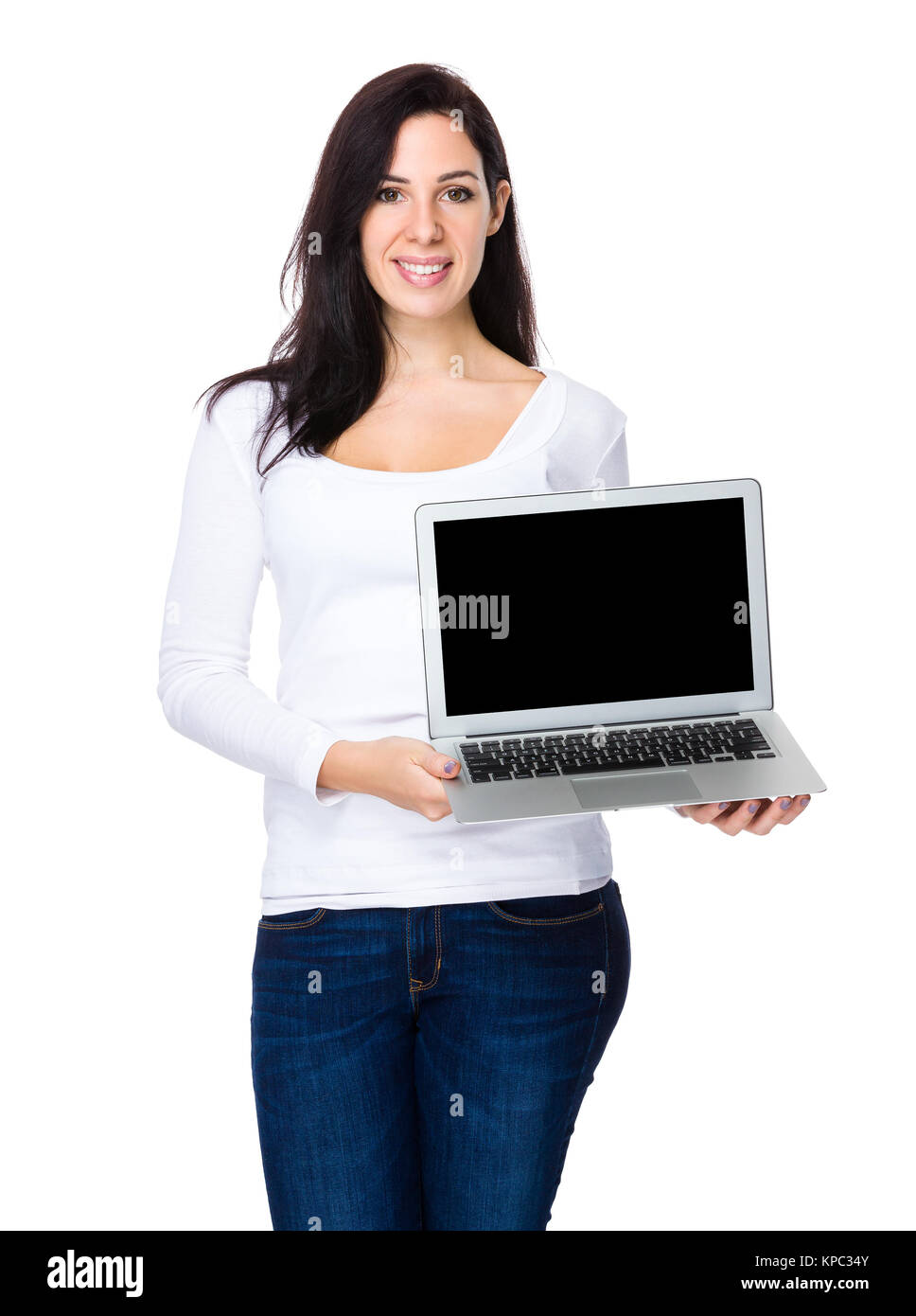Brunette woman show with blank screen of laptop computer Stock Photo ...