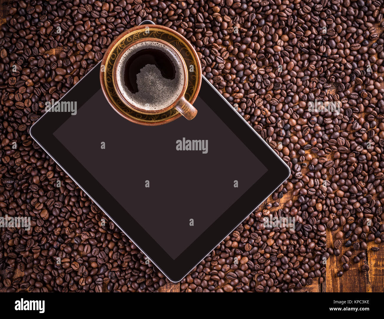 Tablet and coffee Stock Photo - Alamy