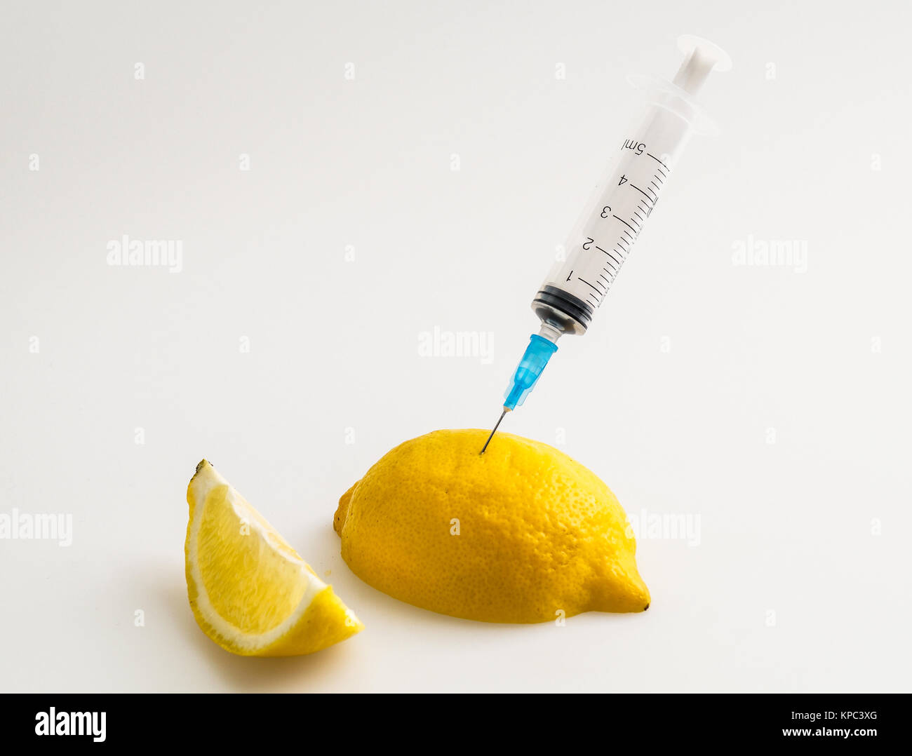 Lemon with syringe Stock Photo - Alamy