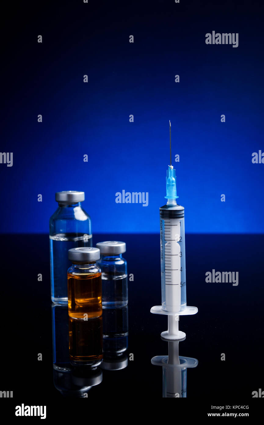 Syringe and medical vials Stock Photo - Alamy