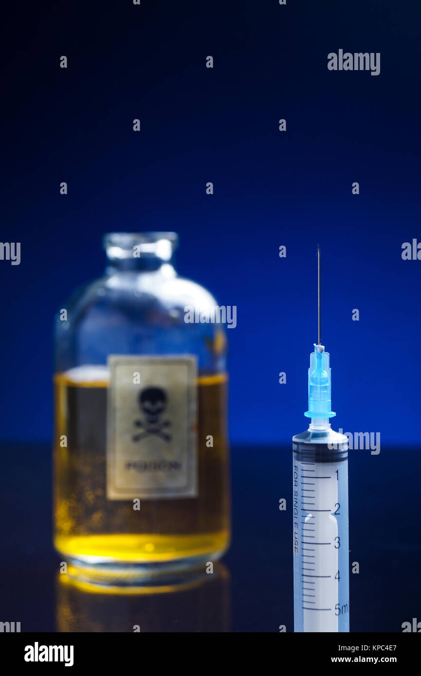 Vintage poison bottle and syringe Stock Photo - Alamy