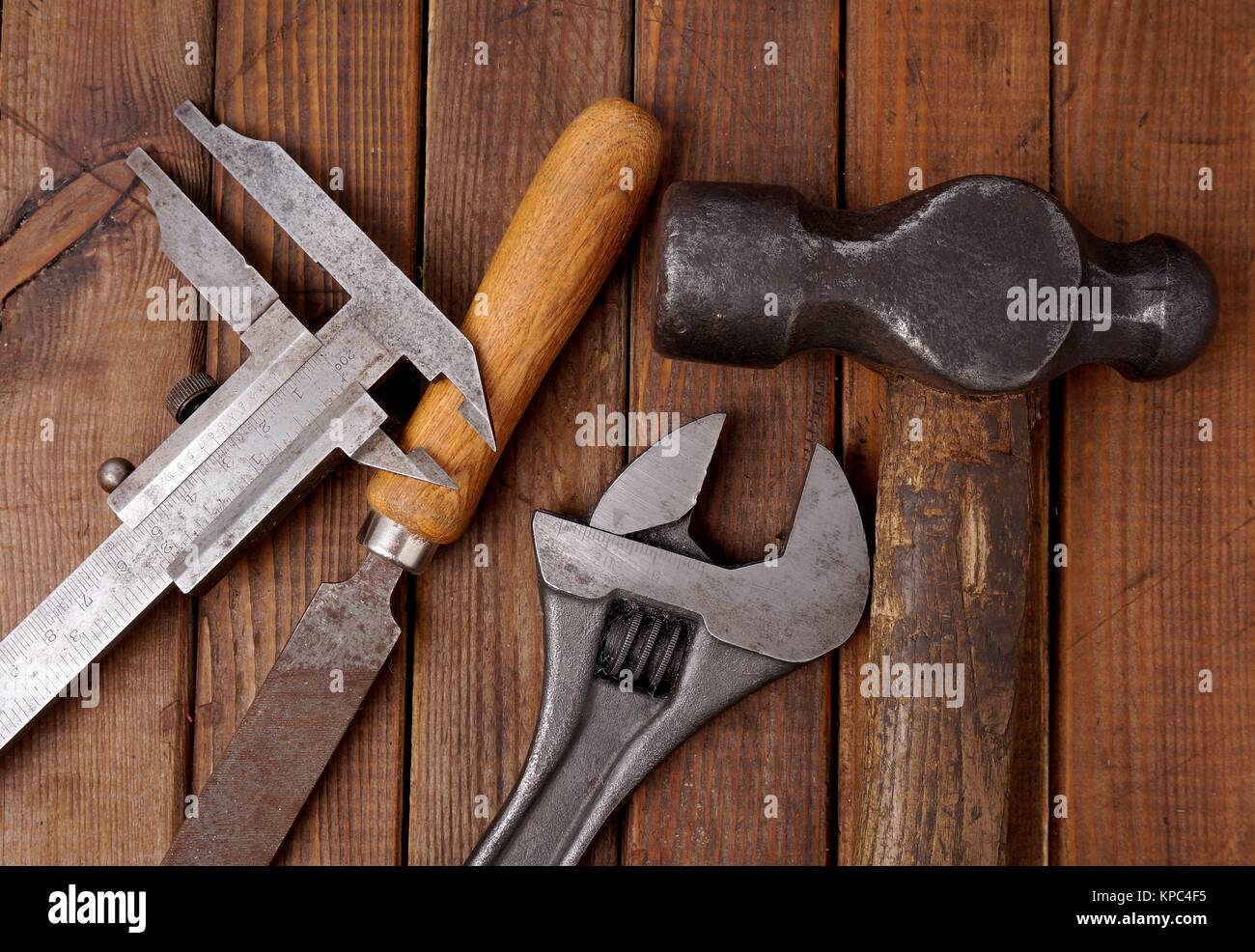 Hammer, caliper, file and wrench Old tools Stock Photo - Alamy