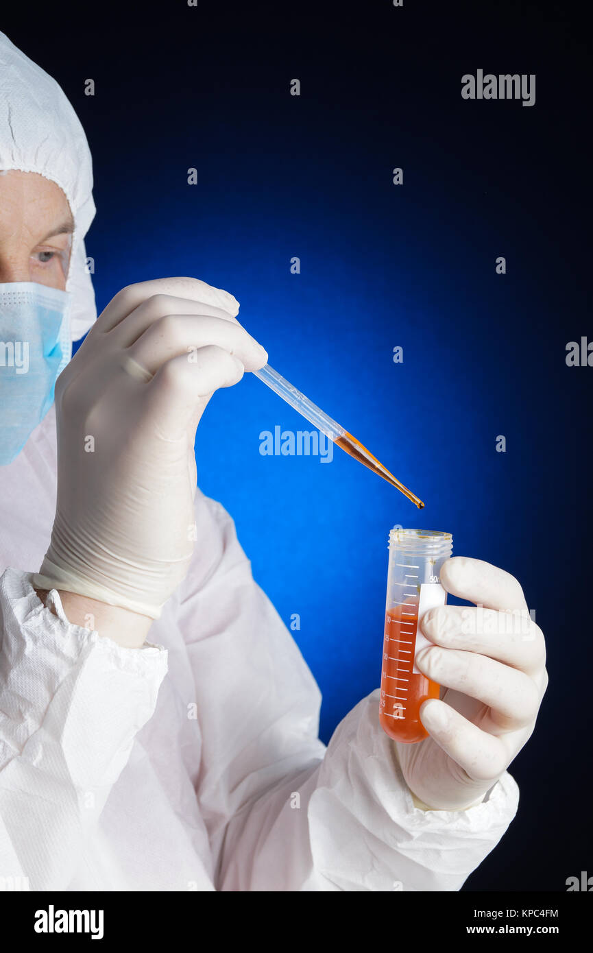 Lab worker testing a sample Stock Photo - Alamy