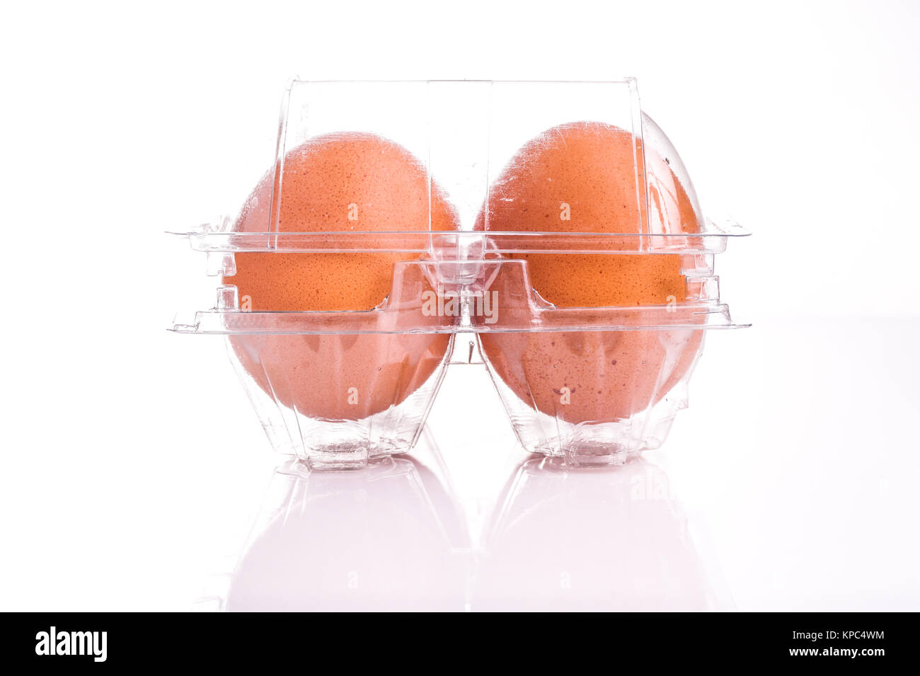 Egg tray with four egg Stock Photo - Alamy