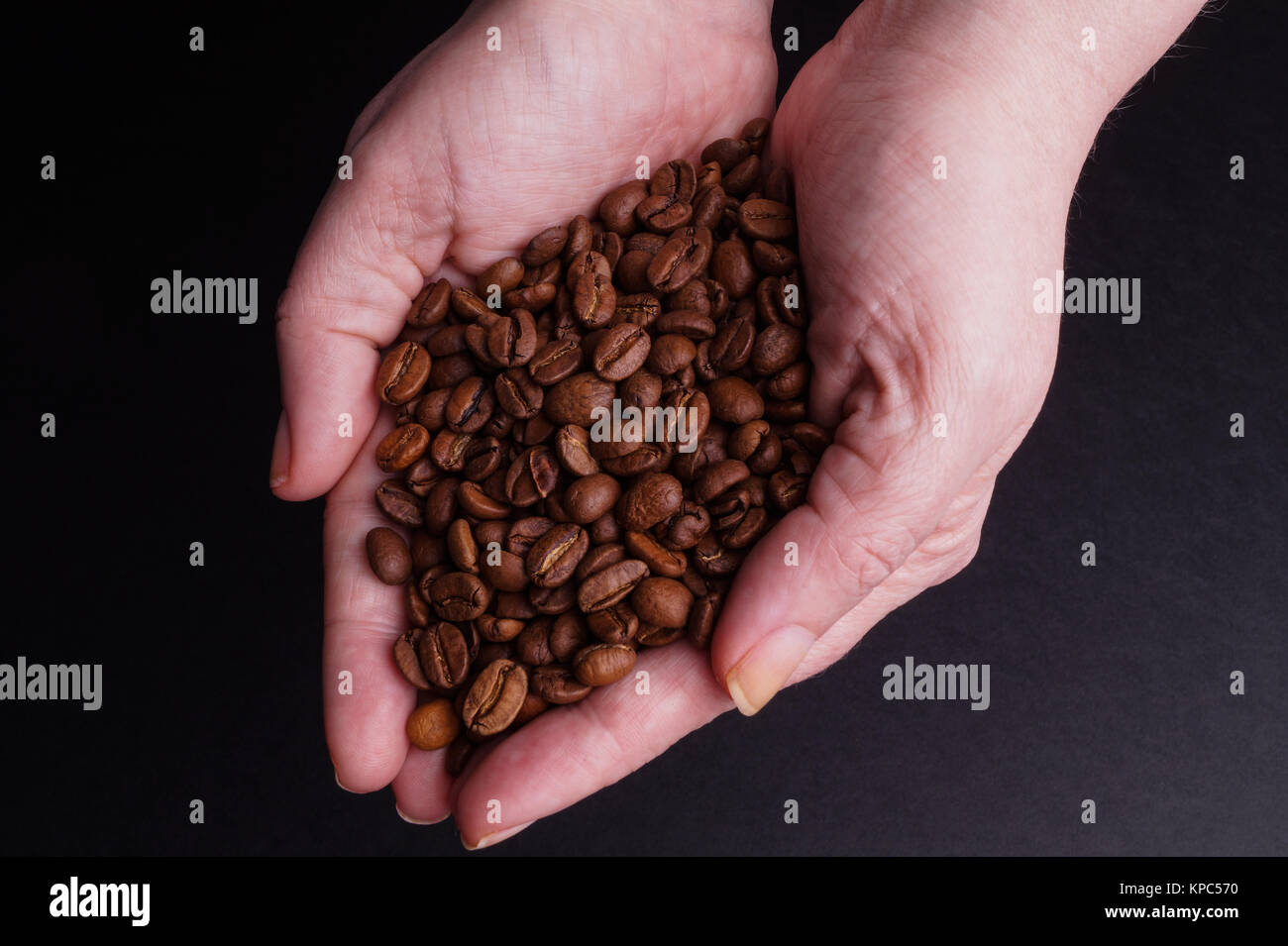 Hands holding Coffee Beans Stock Photo - Alamy