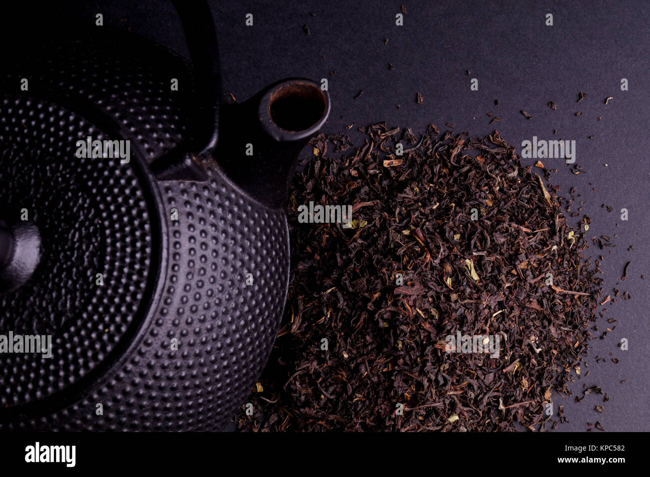Black Teapot with Healthy Tea Leaves Stock Photo - Alamy