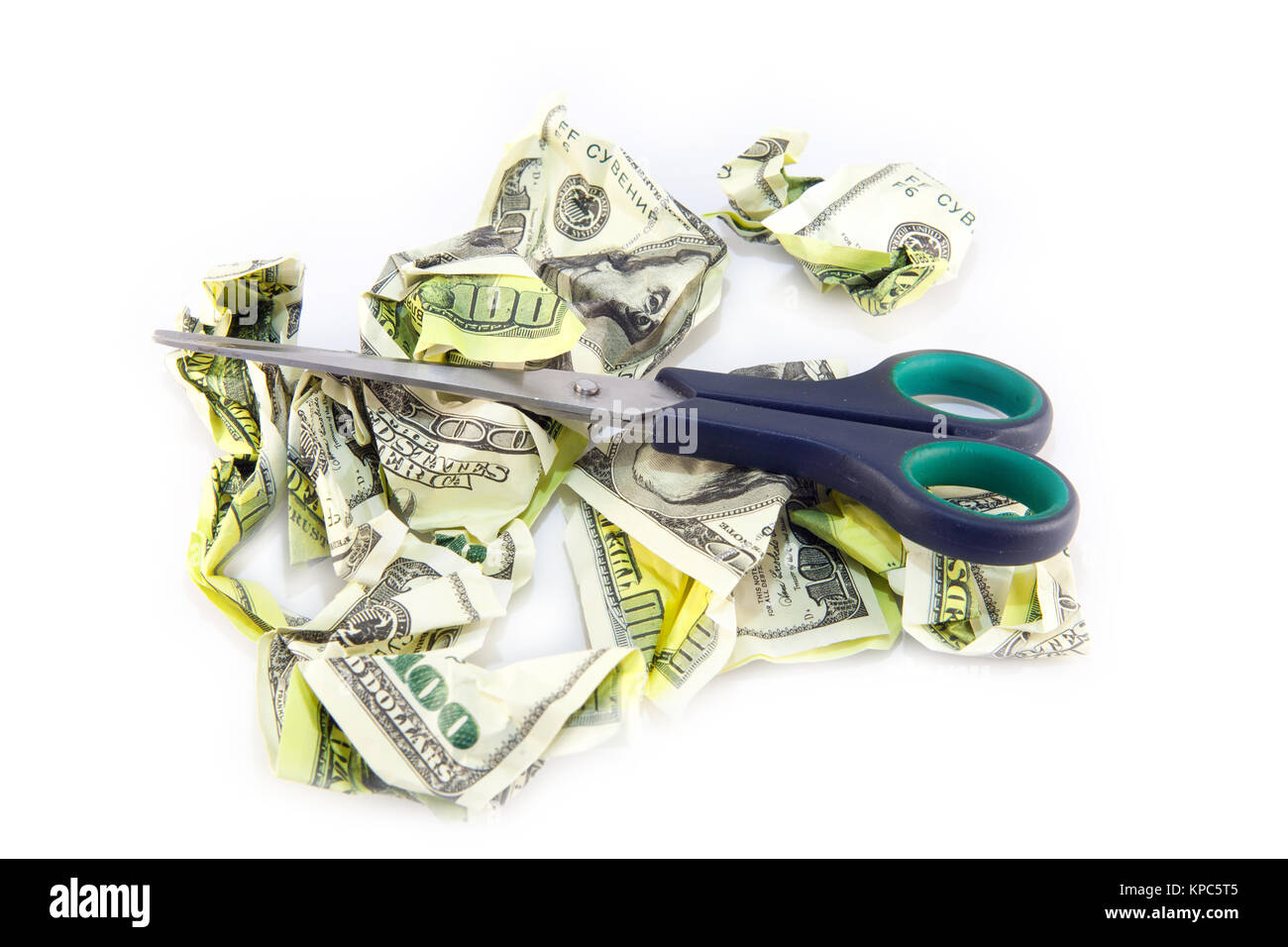 Dollars cut on a white background Stock Photo - Alamy