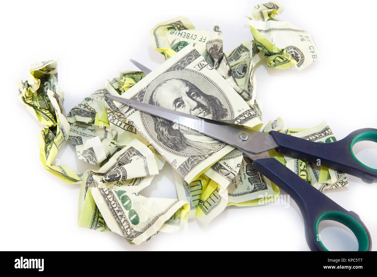 Dollars cut on a white background Stock Photo - Alamy