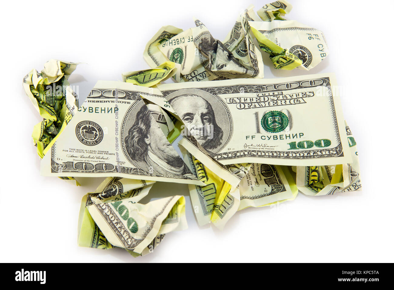 Dollars cut on a white background Stock Photo - Alamy