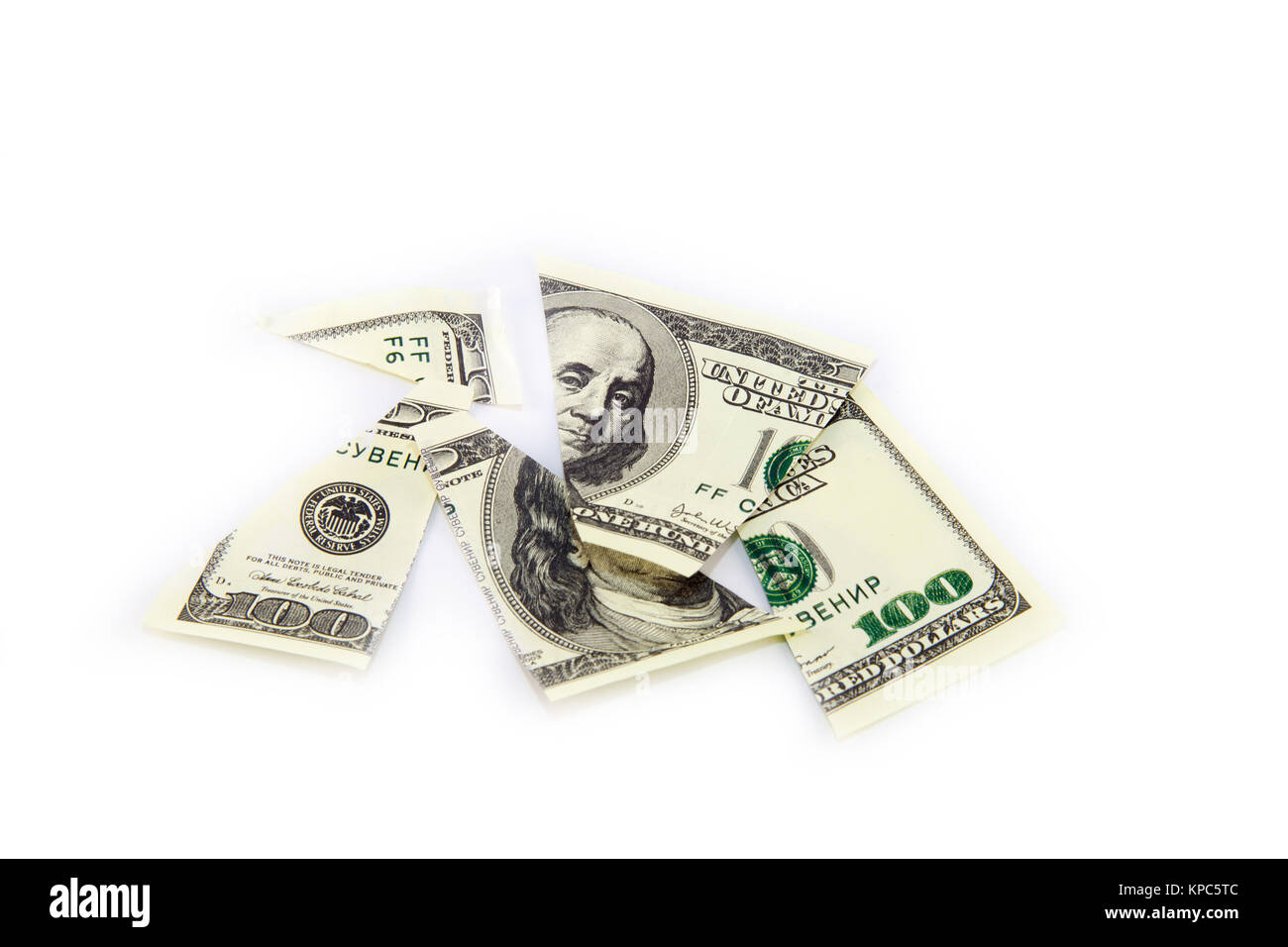 Dollars cut on a white background Stock Photo - Alamy