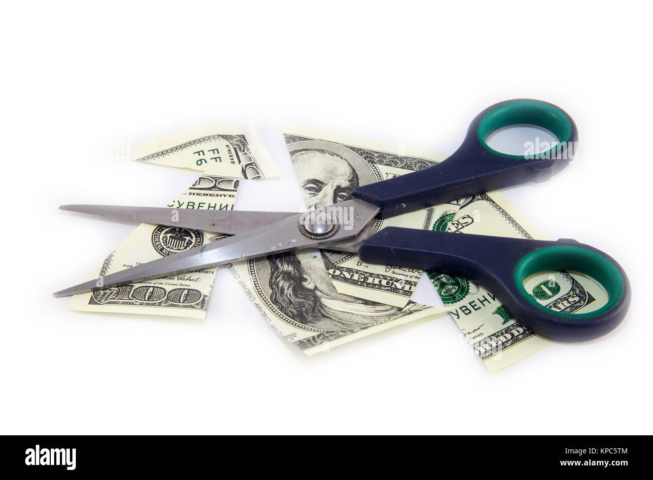 Dollars cut on a white background Stock Photo - Alamy