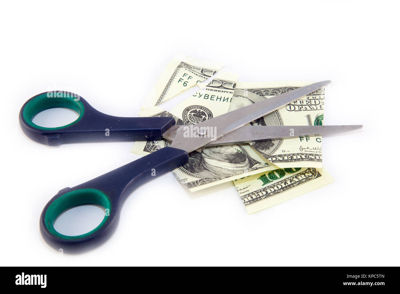 Dollars cut on a white background Stock Photo - Alamy